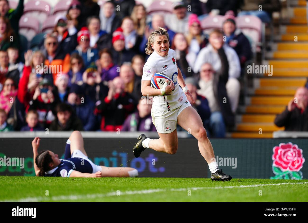 England's Claudia MacDonald breaks clear to score a try during the ...