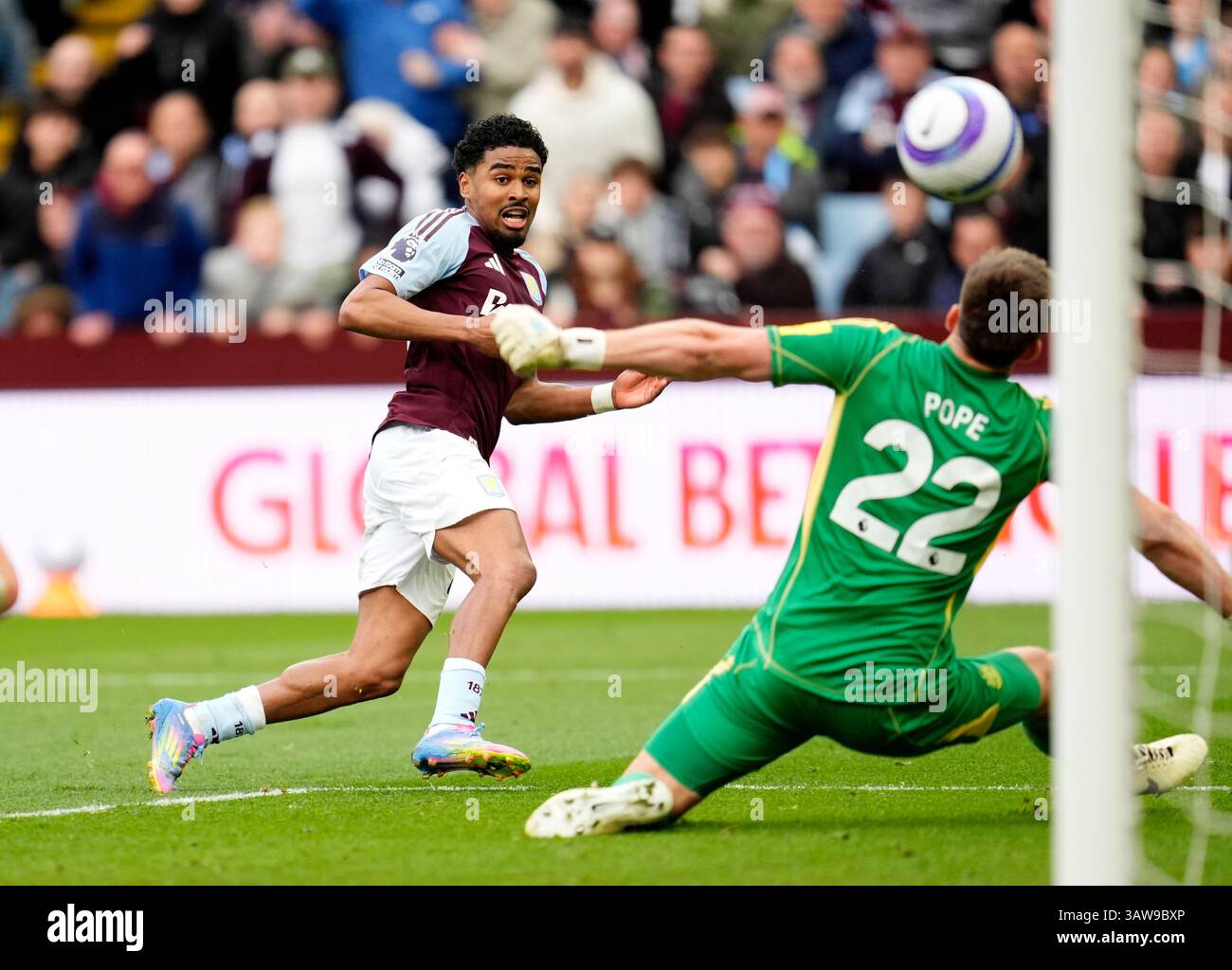 Aston Villa's Ian Maatsen (left) scores past Newcastle United ...