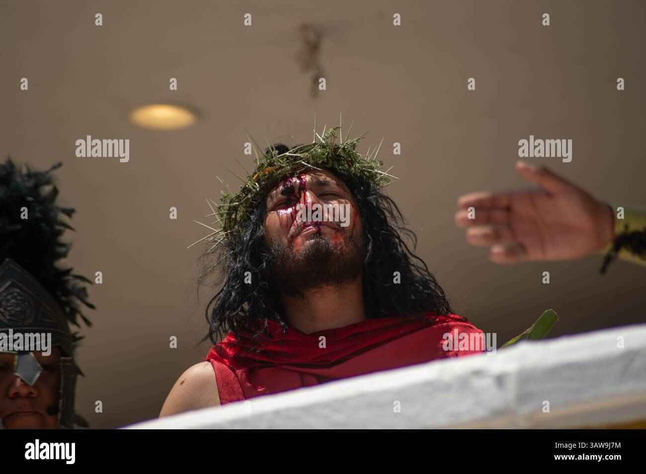 An actor performing Jesus Christ as he re-enacts the Passion of Christ ...
