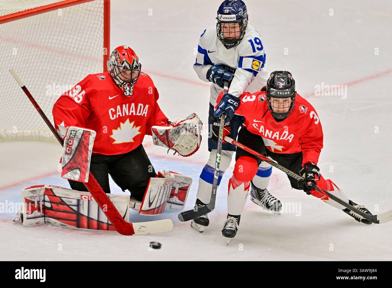 (L-R) Goalkeeper Ann-Renee Desbiens of Canada, Ida Kuoppala of Finland ...
