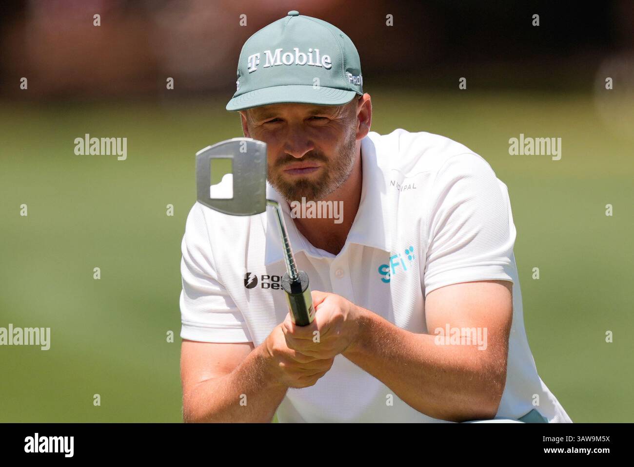 Wyndham Clark lines up a putt on the second hole during the third round ...