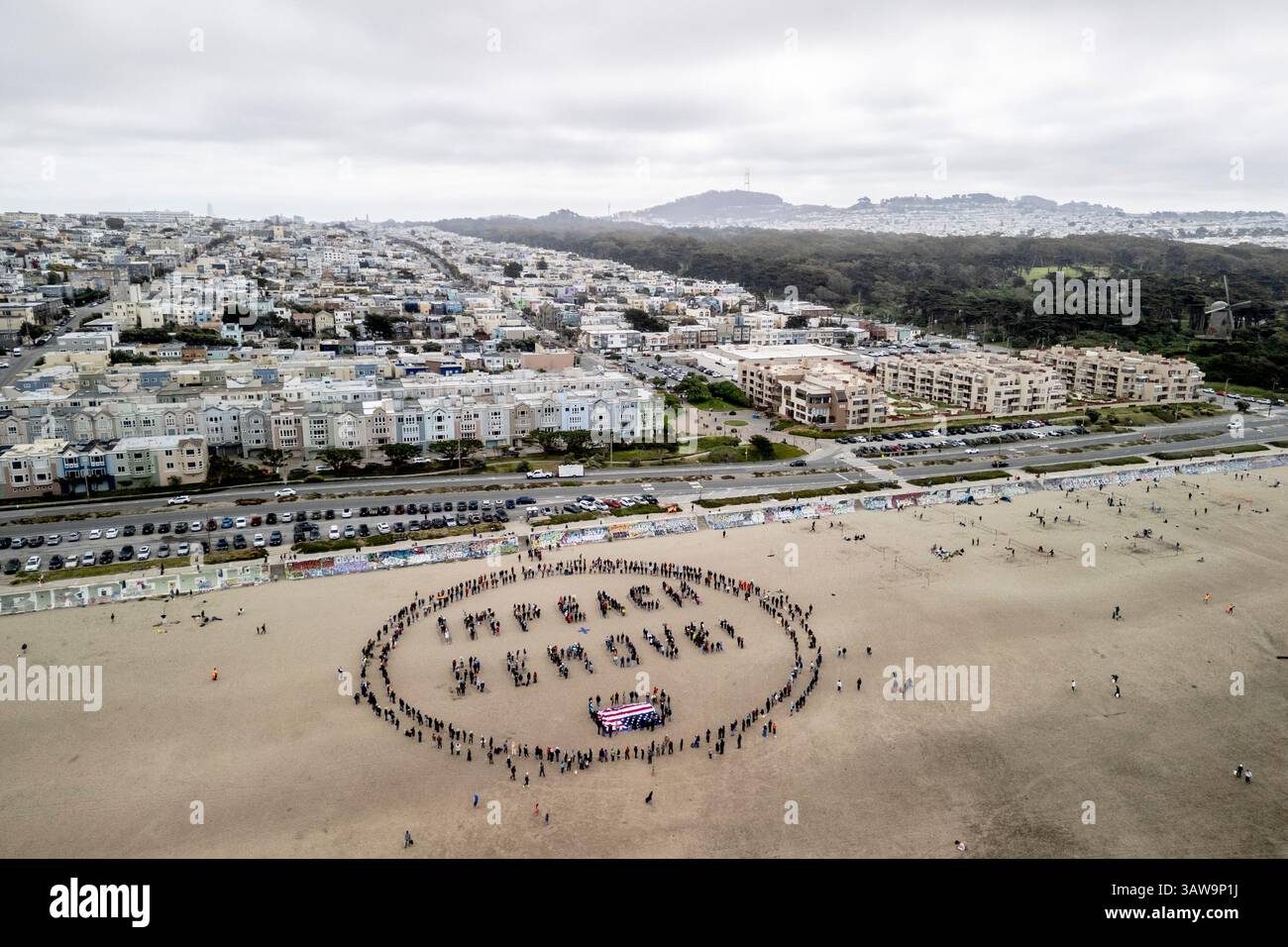 Protesters form a "Impeach & Remove" human banner on Ocean Beach during ...