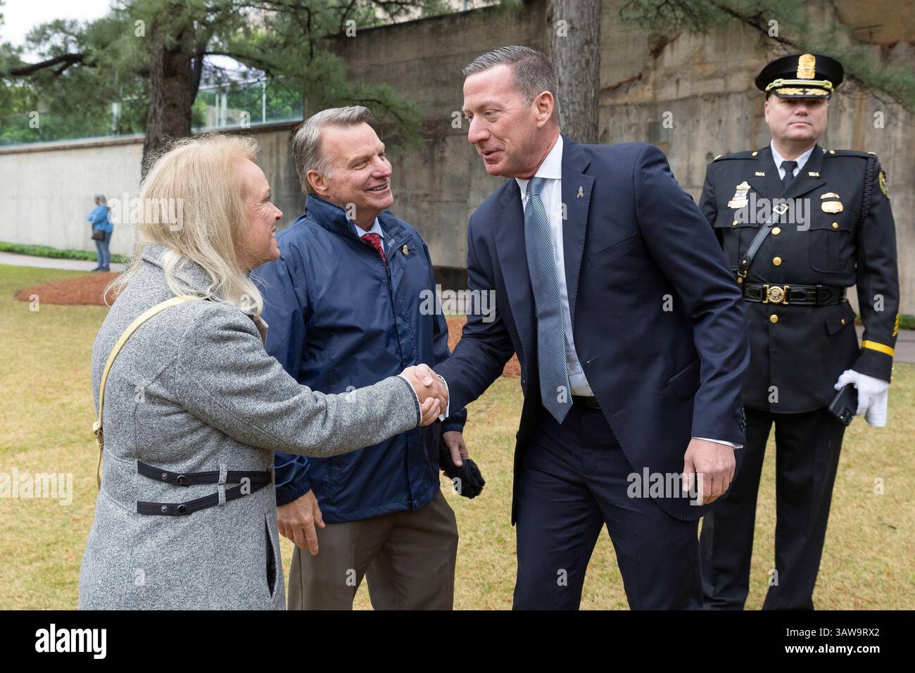U.S. Secret Service Director Sean Curran, right, speaks to friends and ...