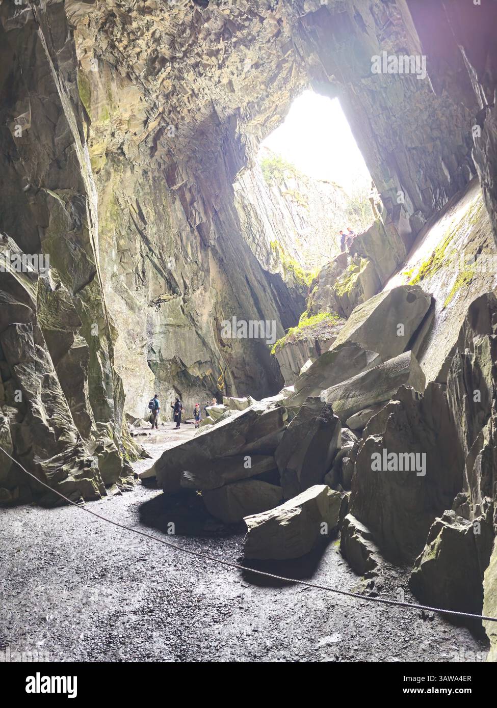 A dramatic view from inside Cathedral Cave in Ambleside, Lake District ...