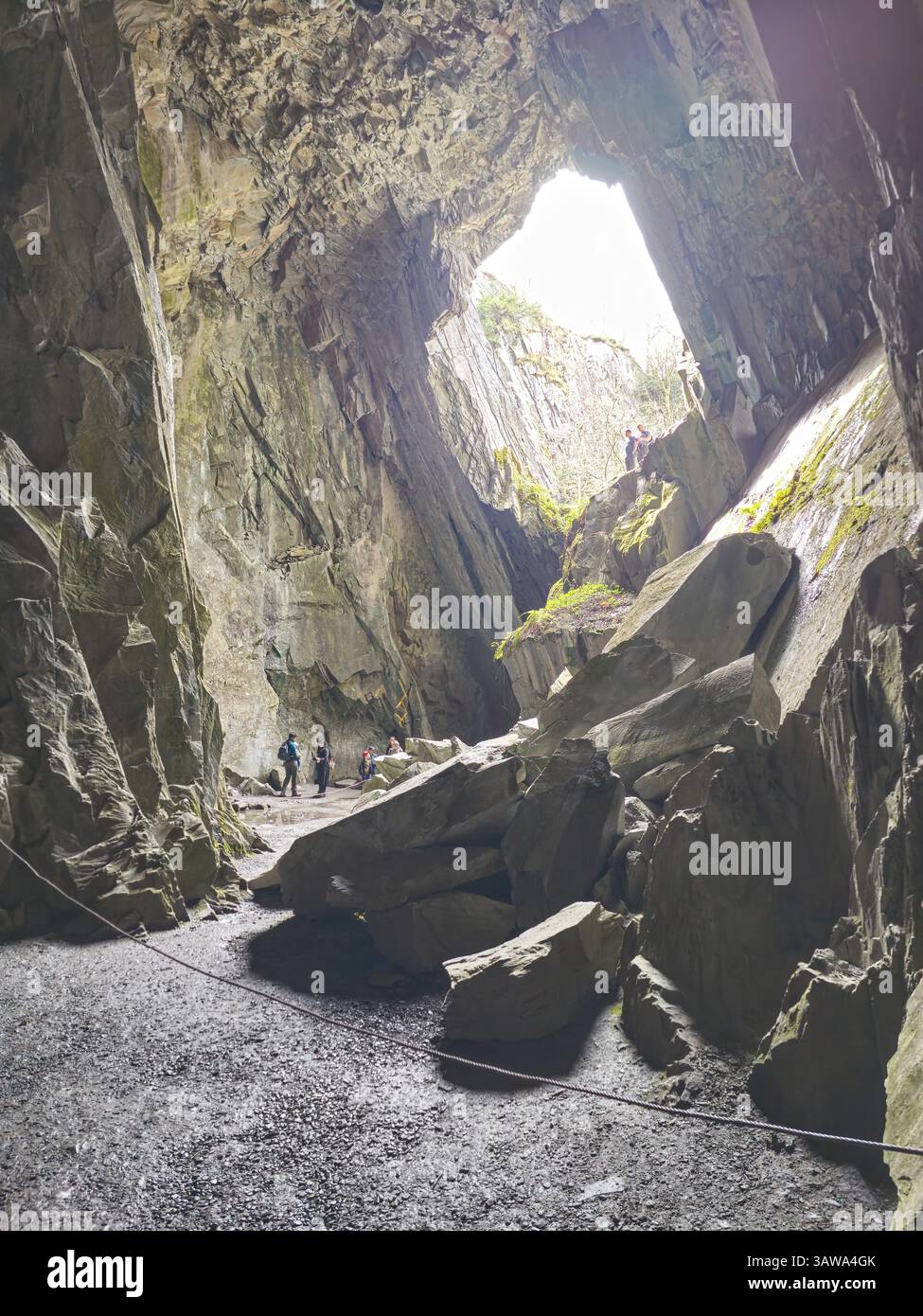 A dramatic view from inside Cathedral Cave in Ambleside, Lake District ...
