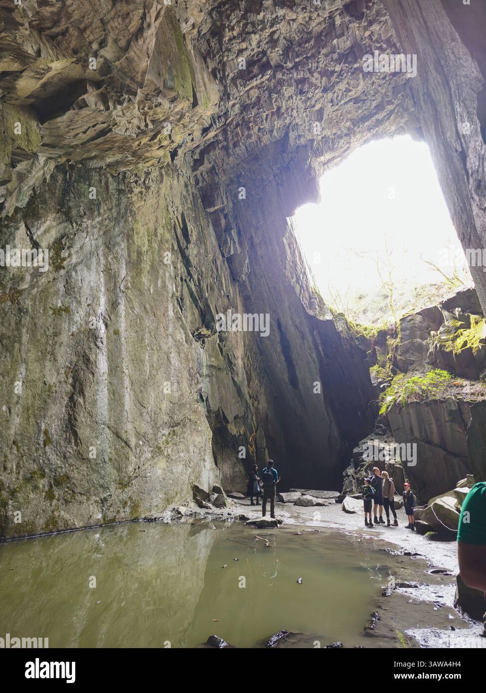 A dramatic view from inside Cathedral Cave in Ambleside, Lake District ...