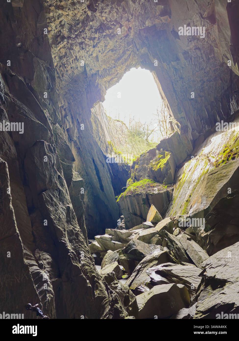 A dramatic view from inside Cathedral Cave in Ambleside, Lake District ...