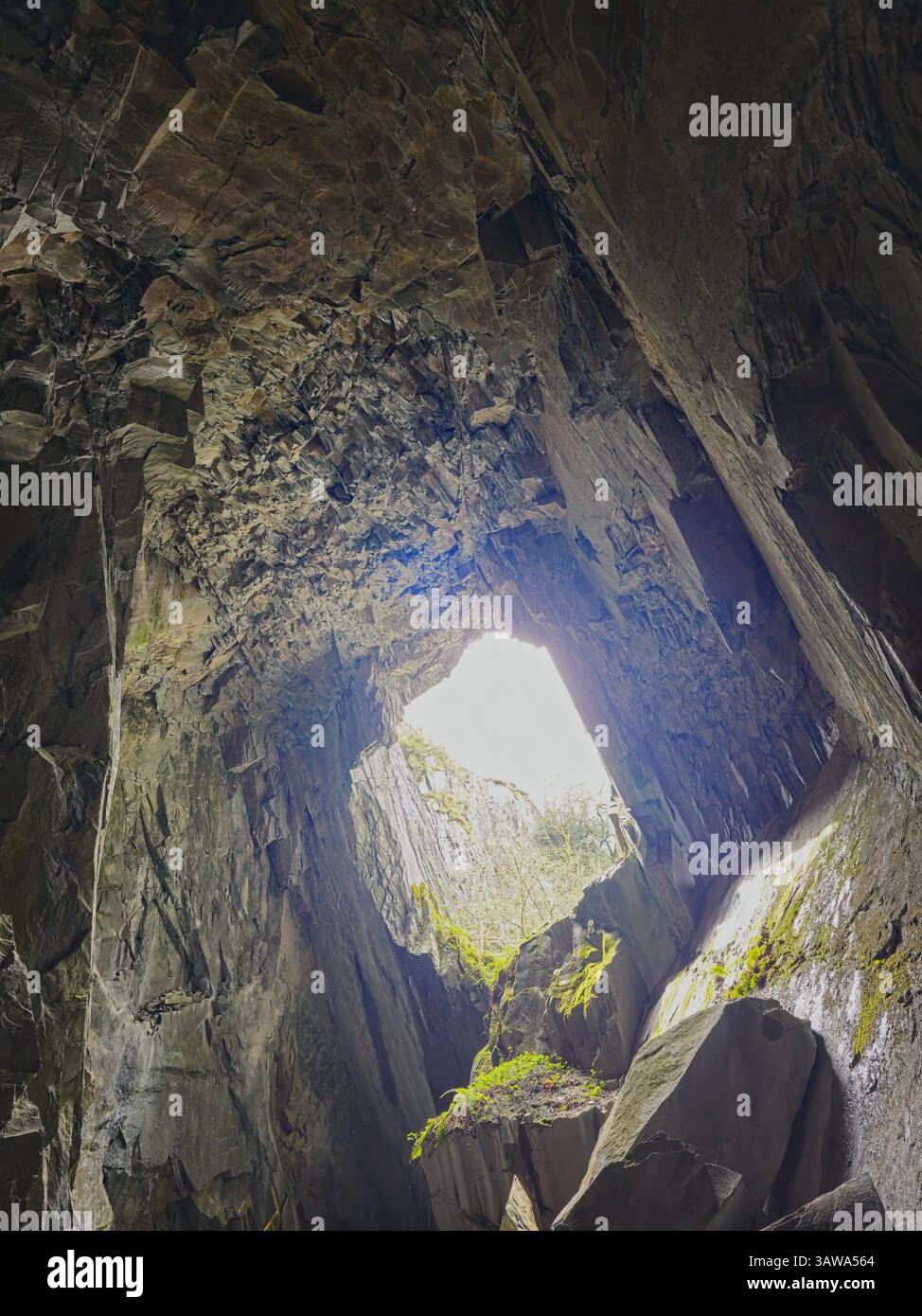 A dramatic view from inside Cathedral Cave in Ambleside, Lake District ...