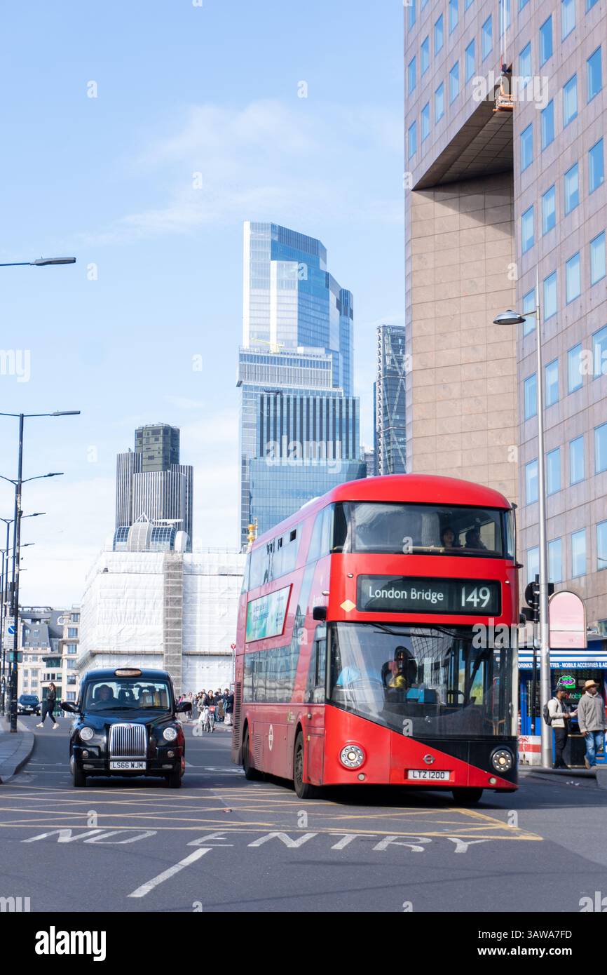 Double decker bus and black cap taxi in London Bridge, UK Stock Photo ...