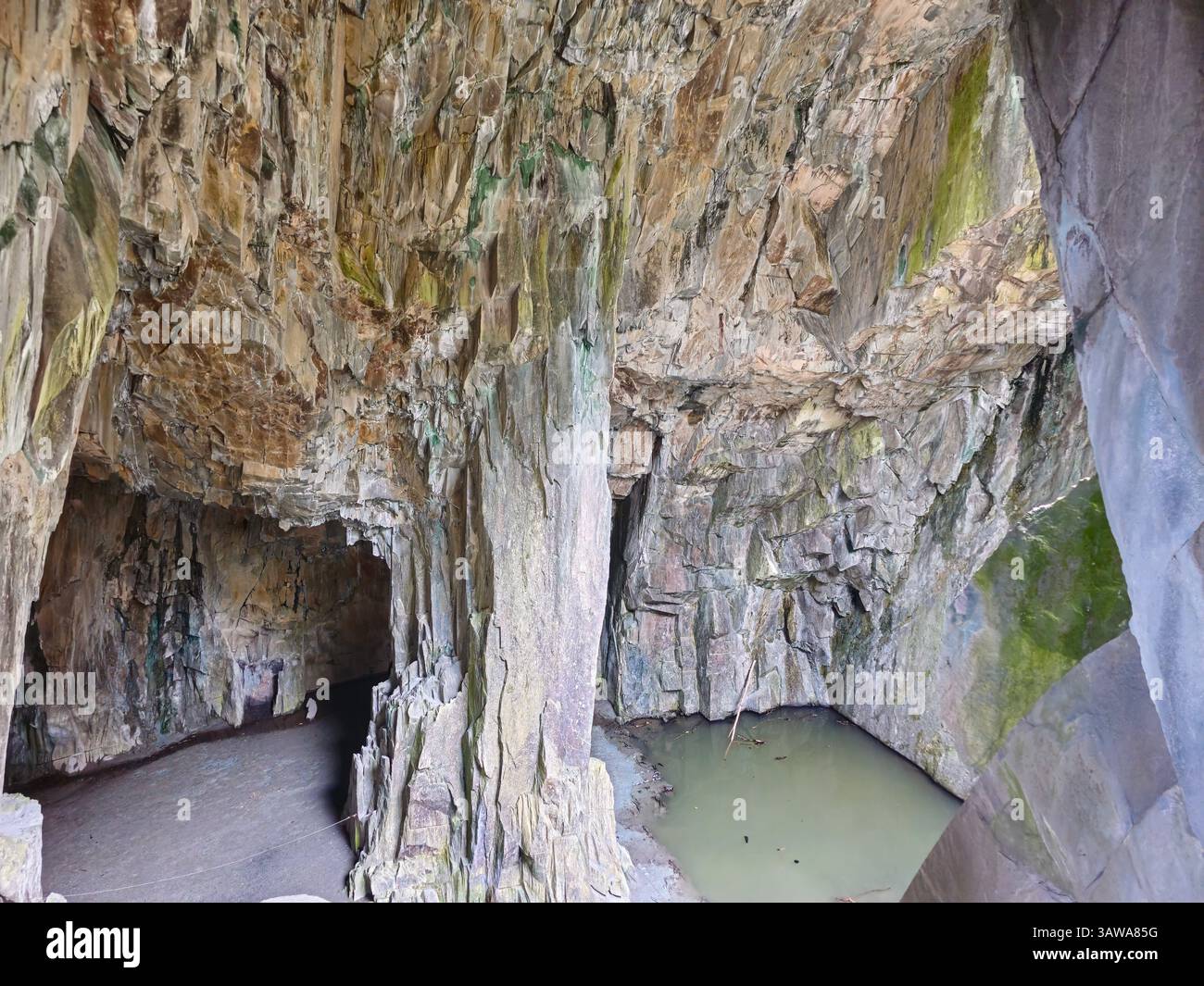 A dramatic interior view of Cathedral Cave in the Lake District ...