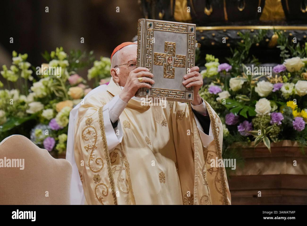 Dean of the College of Cardinals Giovanni Battista Re holds the Holy ...