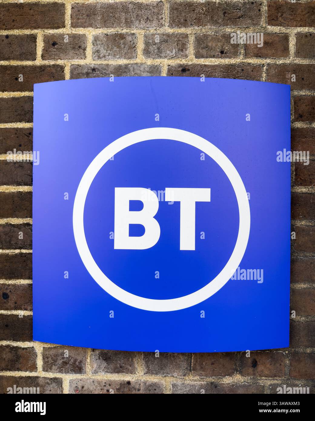 Shrewsbury, England, UK - March 31, 2025; BT logo sign on brick wall ...