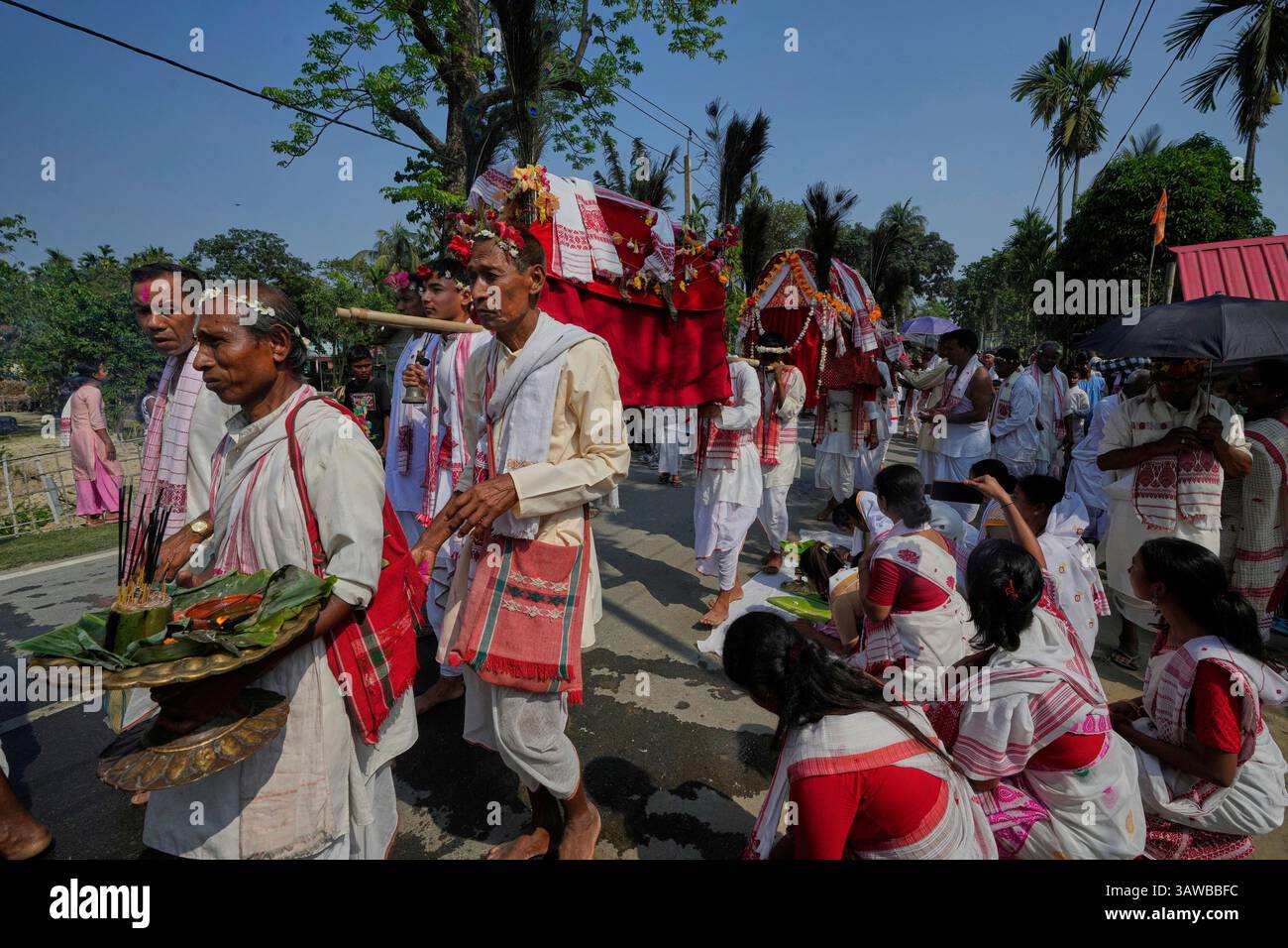 Villagers with traditional Assamese attire participate in the Gohain ...