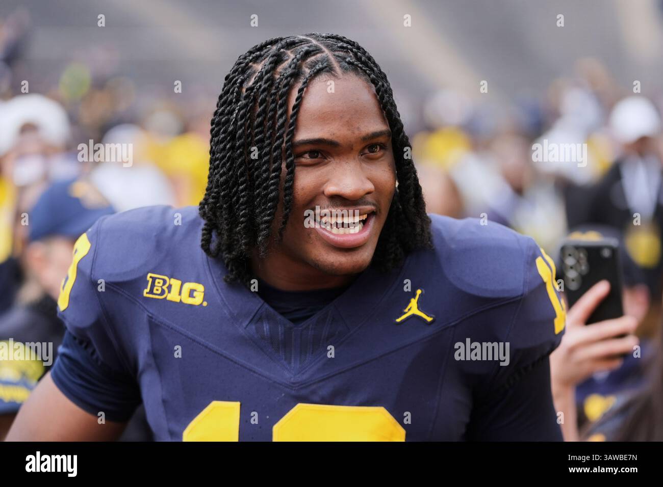 Michigan quarterback Bryce Underwood smiles after an NCAA college ...