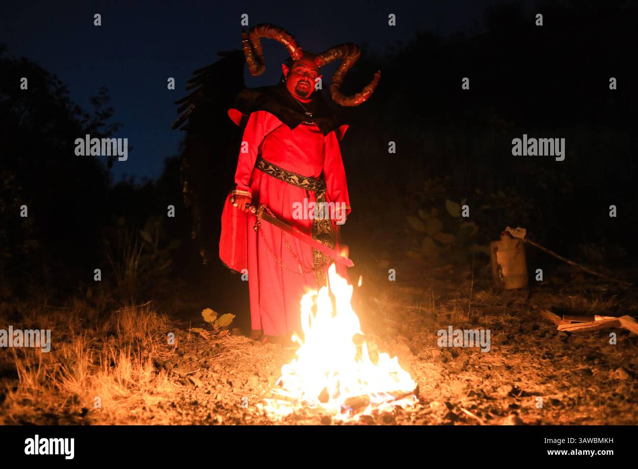 A Person costumed as devil taking part during the Holy Thursday ...