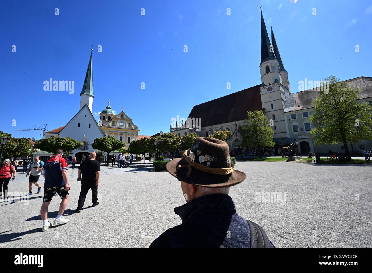 PRODUCTION - 19 April 2025, Bavaria, Altötting: A pilgrim with a hat ...