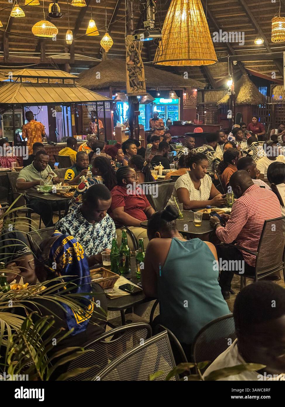 Ghana, Kumasi. Ike's Cafe and Grill, Evening Dinner Crowd Stock Photo ...