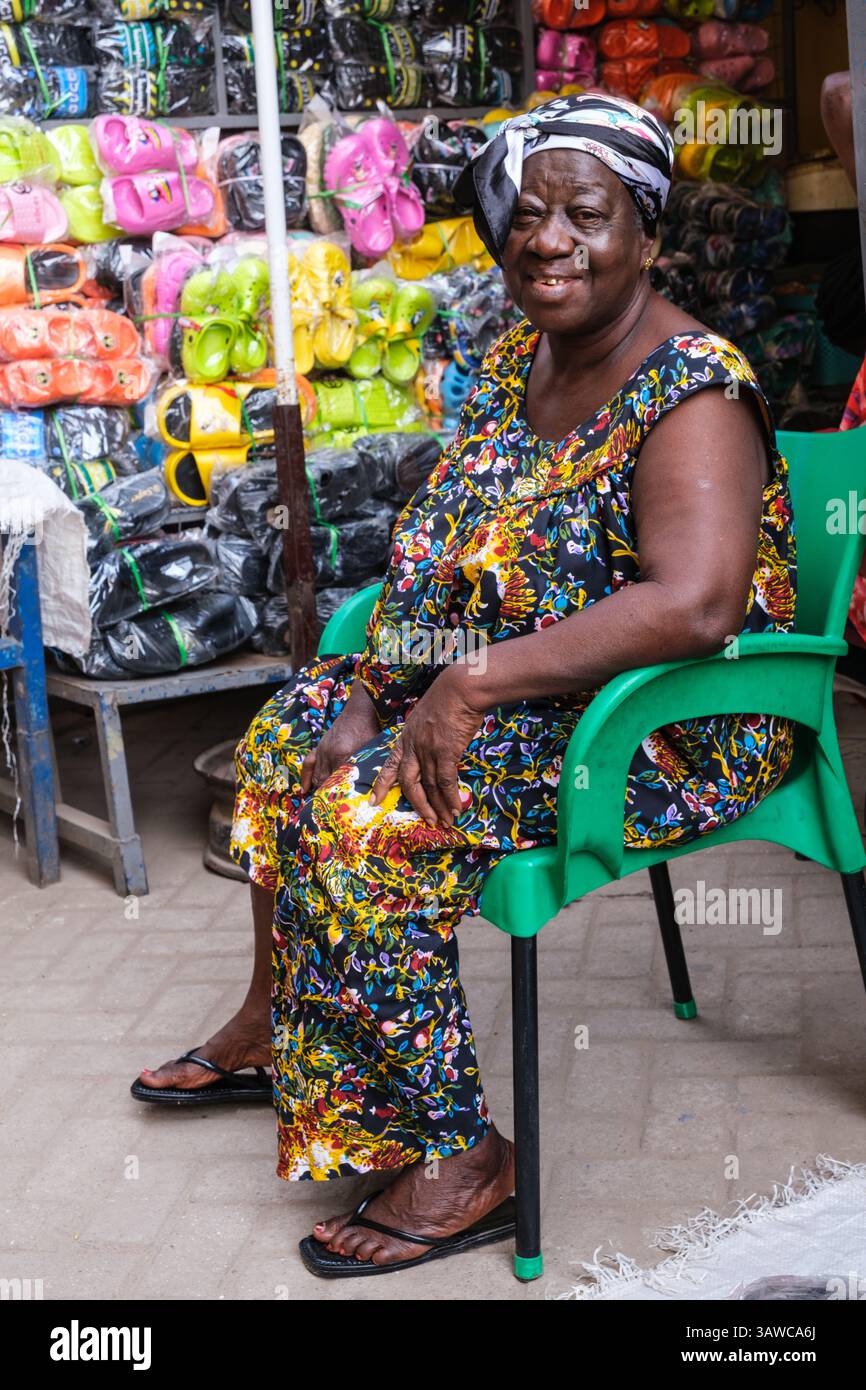 Kumasi, Ghana. Kejetia Market, Woman Vendor of Sandals and Shoes Stock ...