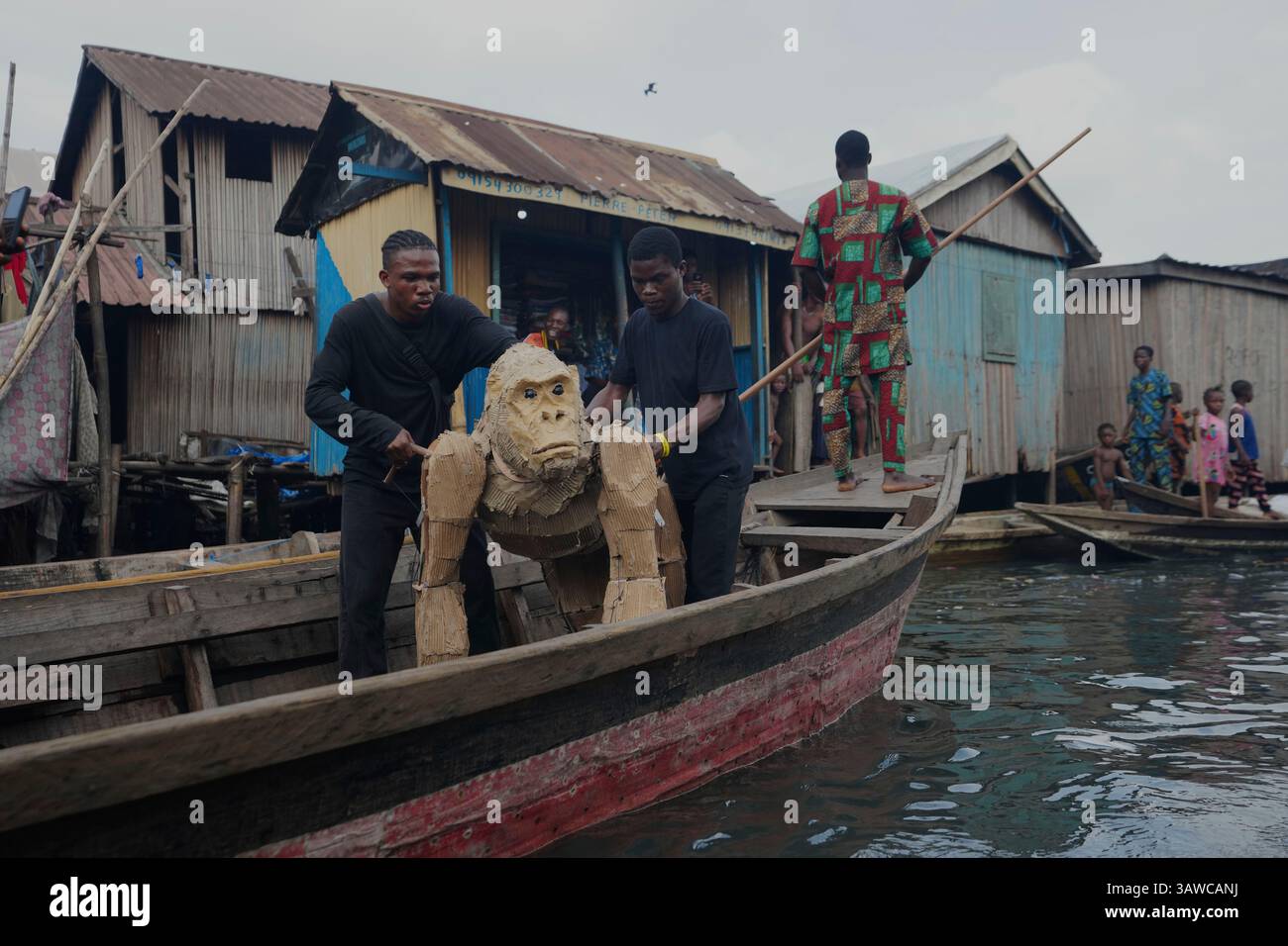 Puppeteers move cardboard animals in canoes at the Makoko Slum in Lagos ...