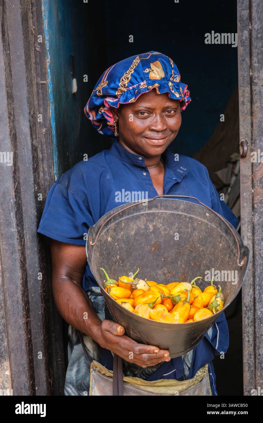 Kumasi, Ghana. Kejetia Market, Woman Holdiung Bucket of Peppers Stock ...