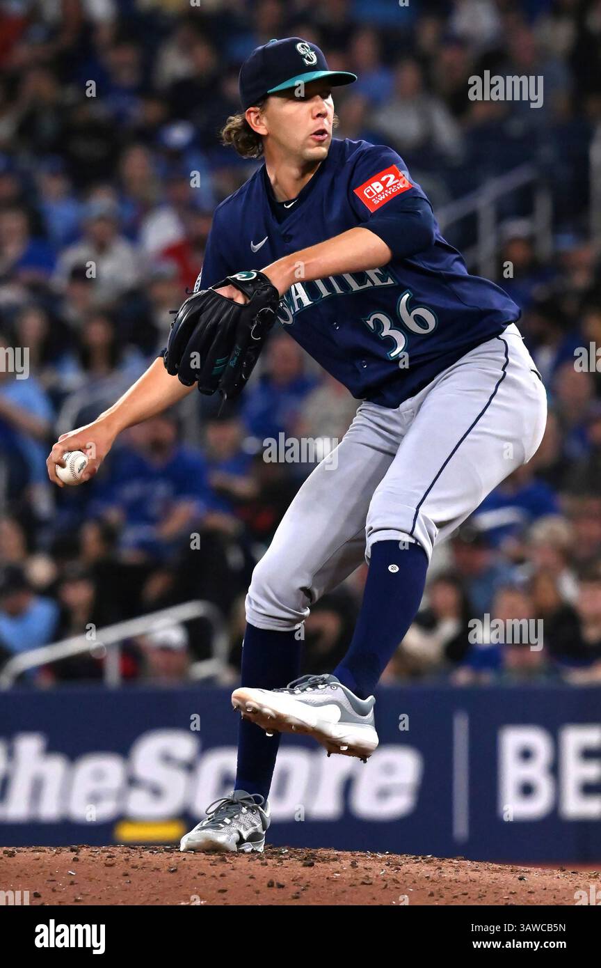 Seattle Mariners starting pitcher Logan Gilbert winds up to throw to a ...