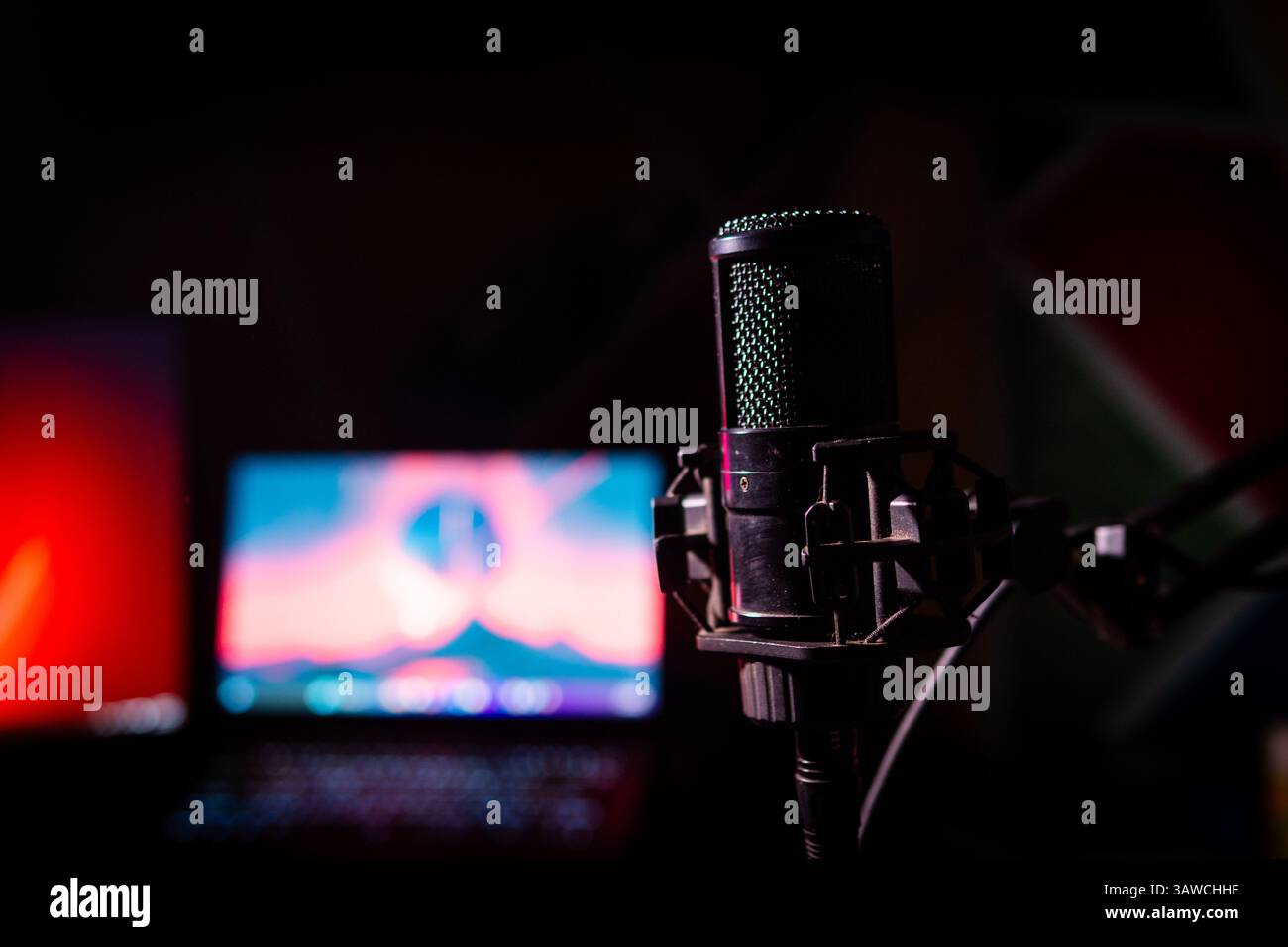 A studio microphone in dramatic lighting setup with soft focus ...