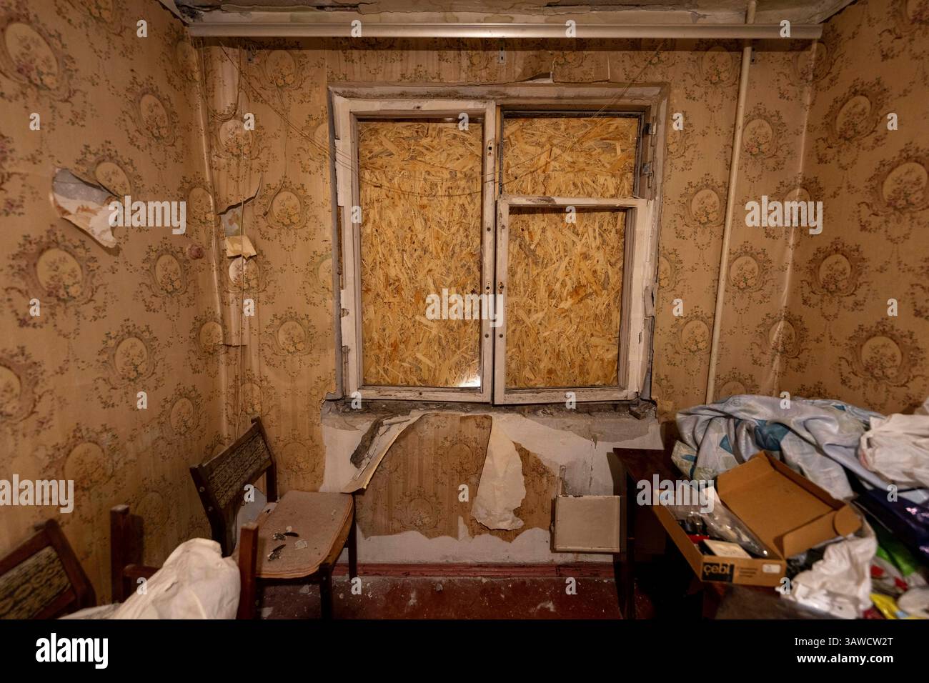 A partially destroyed room is seen inside a residential building in ...