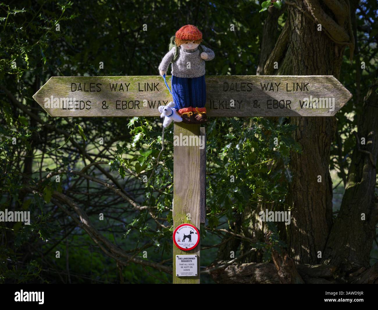 Yarnbomb person attached to fingerpost (long-distance public footpath ...