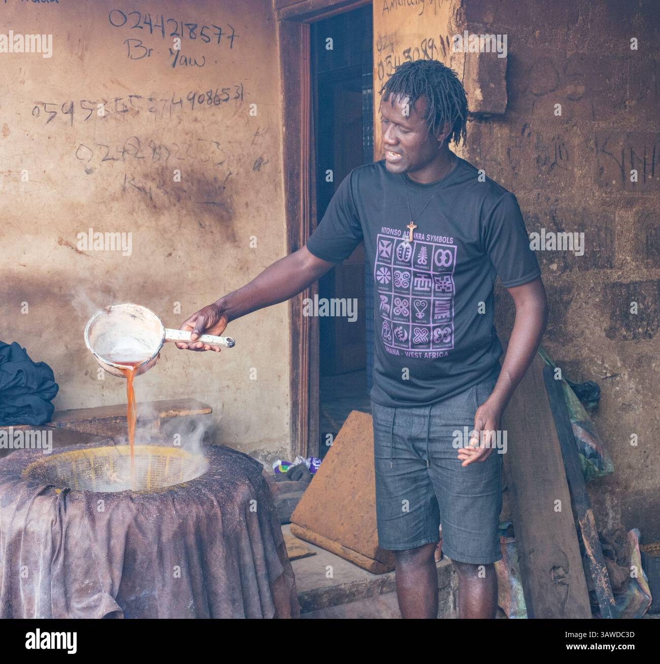 Ghana, Asonomaso. Ntonso Adinkra Village. Black Dye from the bark of ...