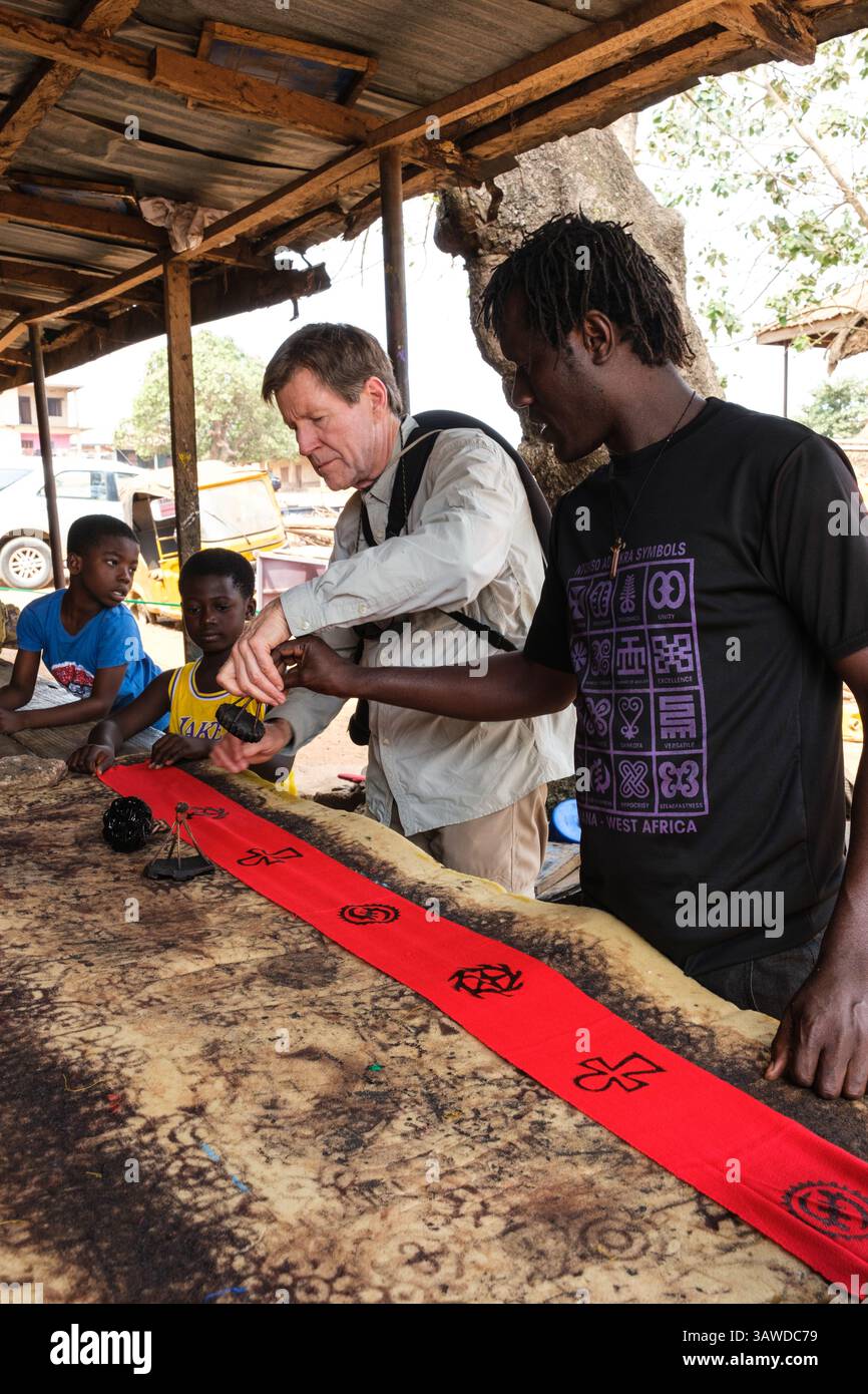 Ghana, Asonomaso. Ntonso Adinkra Village. Tourist Stamping Adinkra ...