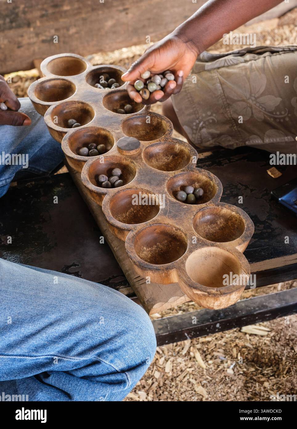 Ghana, near Kumasi. Men Playing Oware, a Game which some believe to be ...