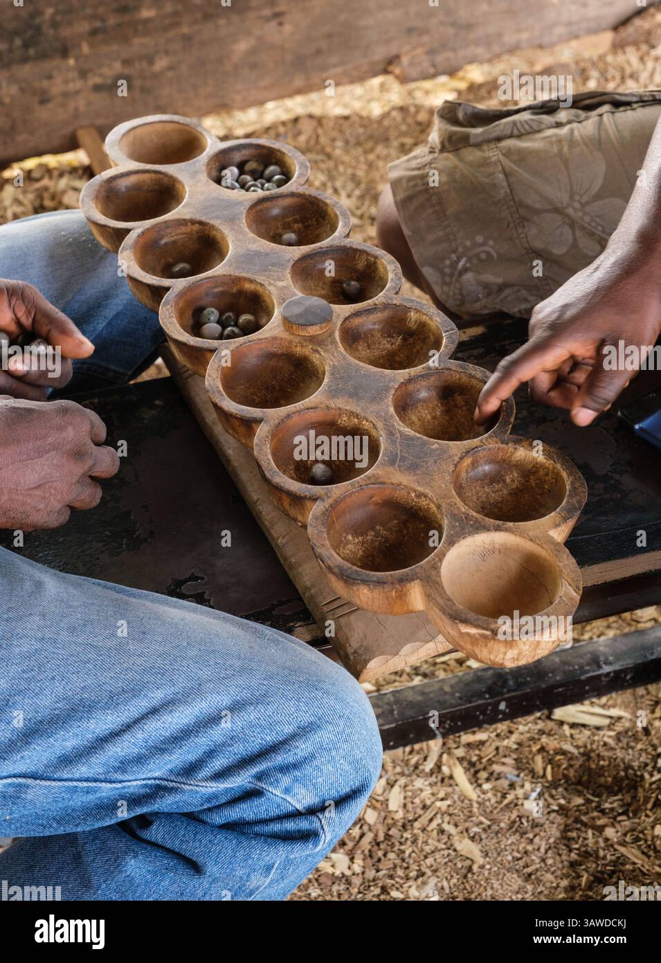 Ghana, near Kumasi. Men Playing Oware, a Game which some believe to be ...
