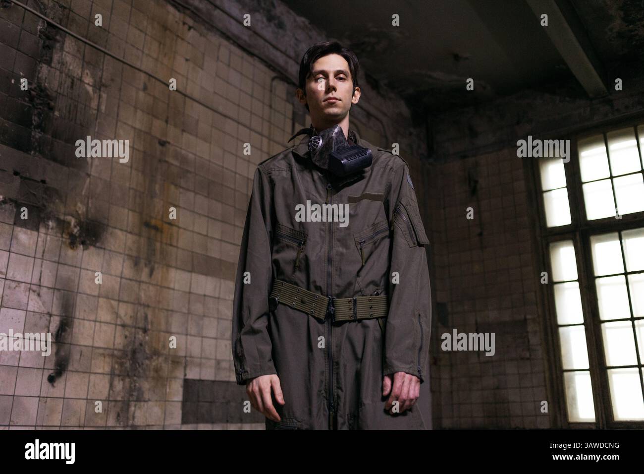 Tactical operator in military jumpsuit wearing gas mask, gritty ...