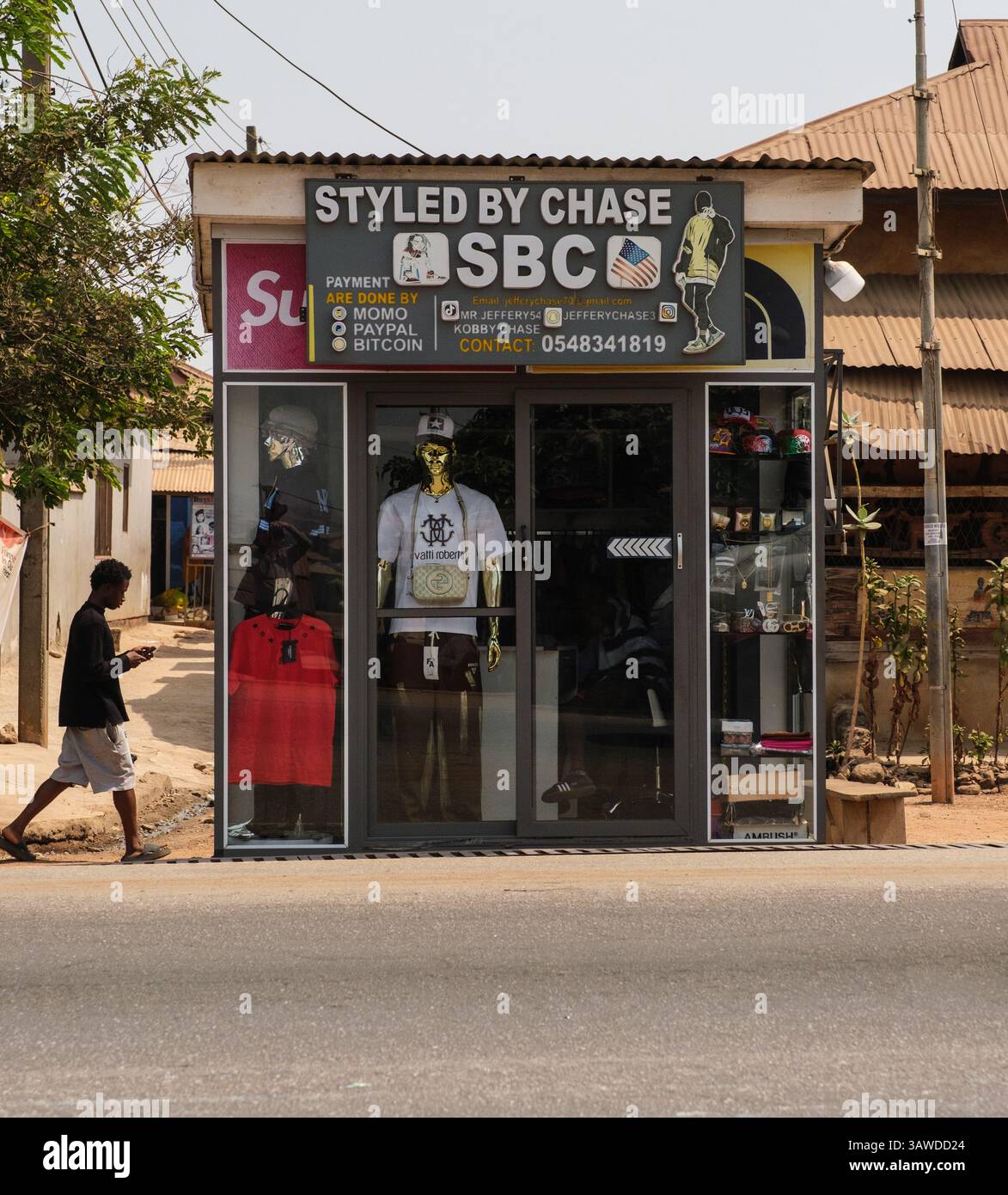 Ghana, Kumasi. Road-side Clothing Store Stock Photo - Alamy