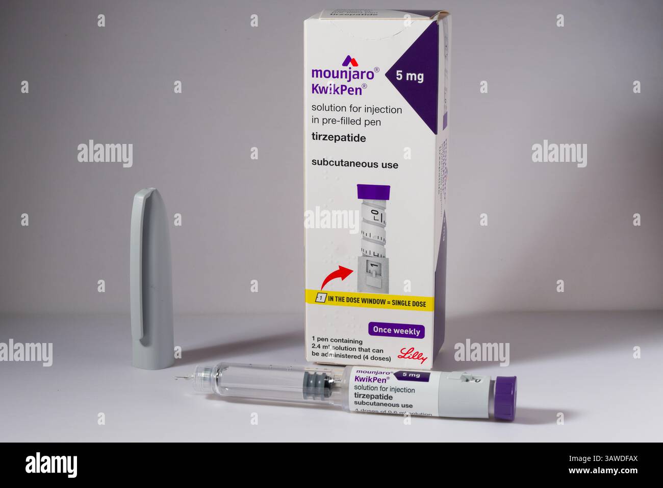 Mounjaro ® KwikPen (tirzepatide) weight less diabetes pen on a white ...