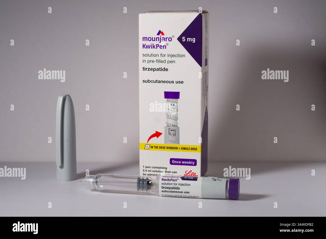 Mounjaro ® KwikPen (tirzepatide) weight less diabetes pen on a white ...