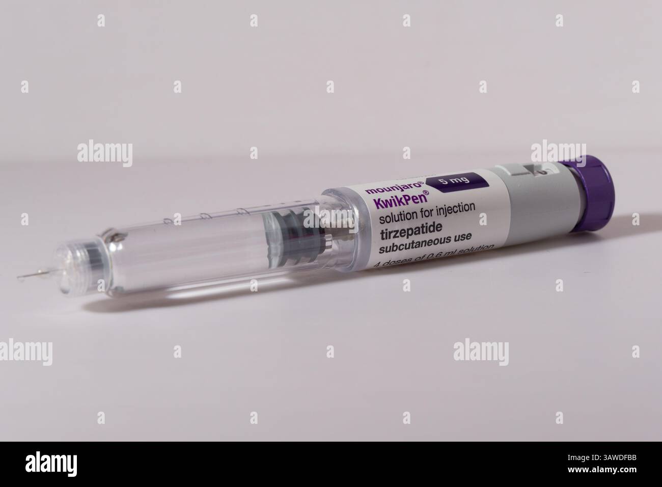 Mounjaro ® KwikPen (tirzepatide) weight less diabetes pen on a white ...