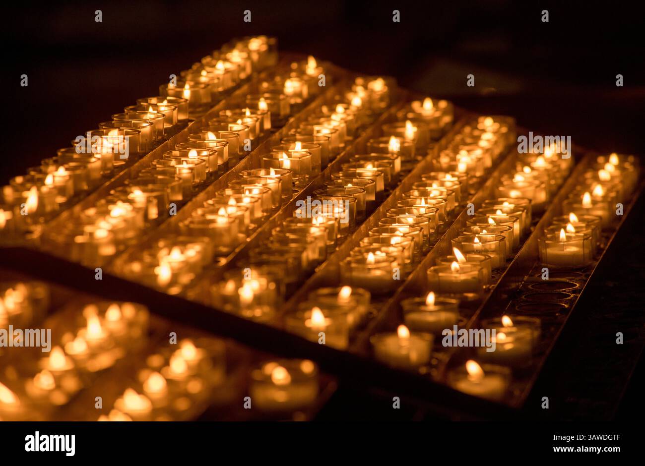 In churches, candles are lit before a statue or sacred image of Jesus ...