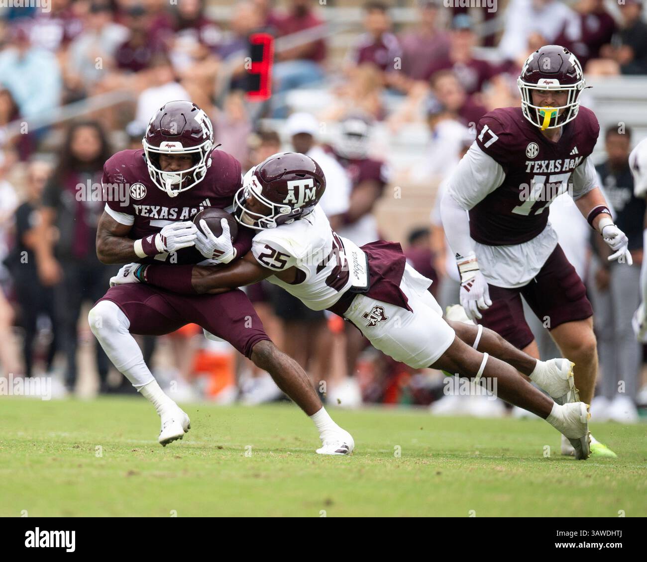 Texas A&M defensive back Dalton Brooks (25) tackles wide receiver KC ...
