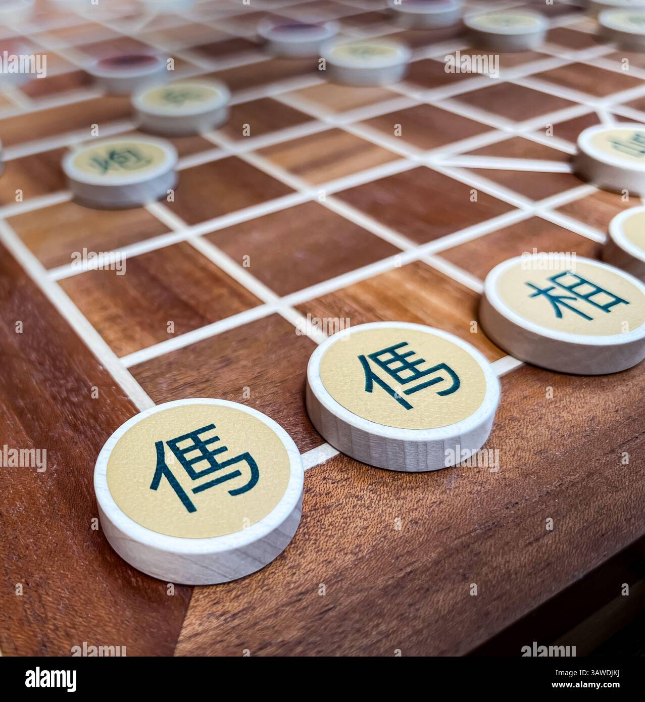 A traditional Xiangqi (Chinese chess) board set, featuring intricately ...