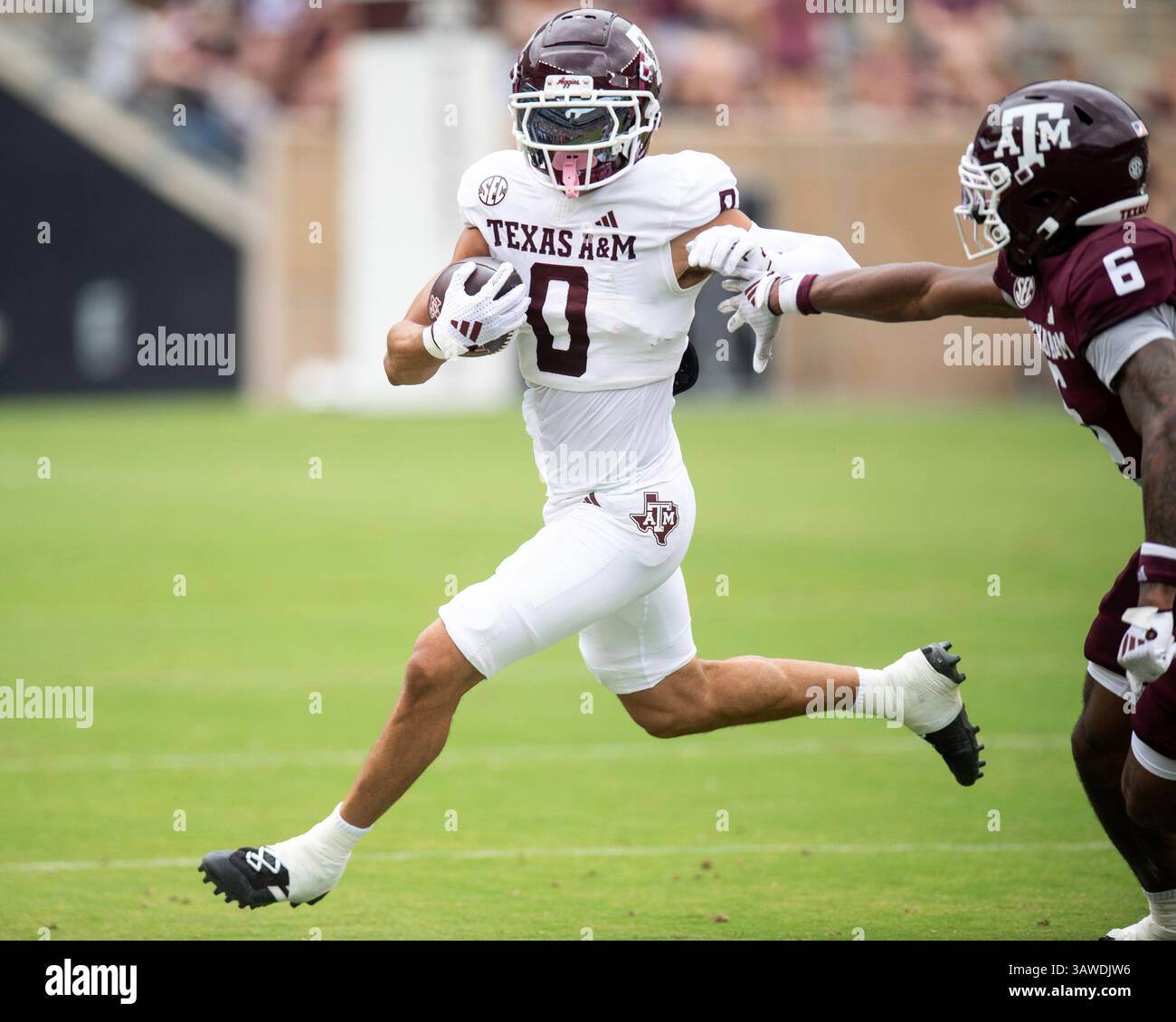 Texas A&M wide receiver Izaiah Williams (0) makes a catch and runs the ...