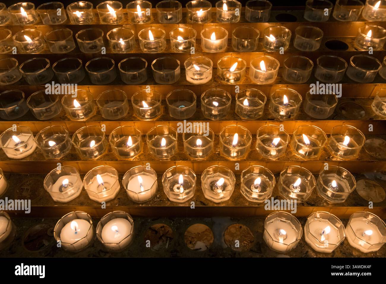 In churches, candles are lit before a statue or sacred image of Jesus ...