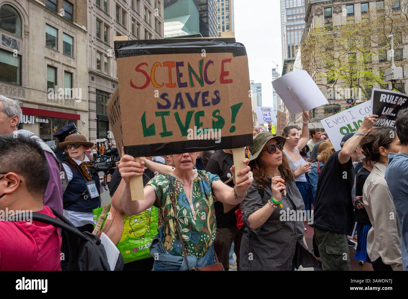 New York, United States. 19th Apr, 2025. A person holds a "SCIENCE ...