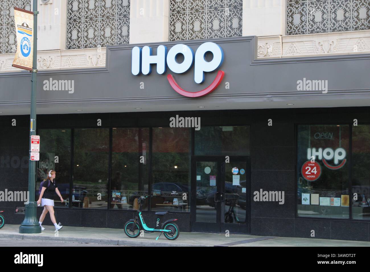 San Antonio, USA. 18th Apr, 2025. A person walks in front of the IHOP ...