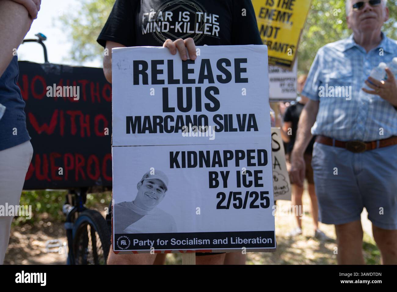 St Petersburg, Florida, USA. 19th Apr, 2025. A protesters holds a ...