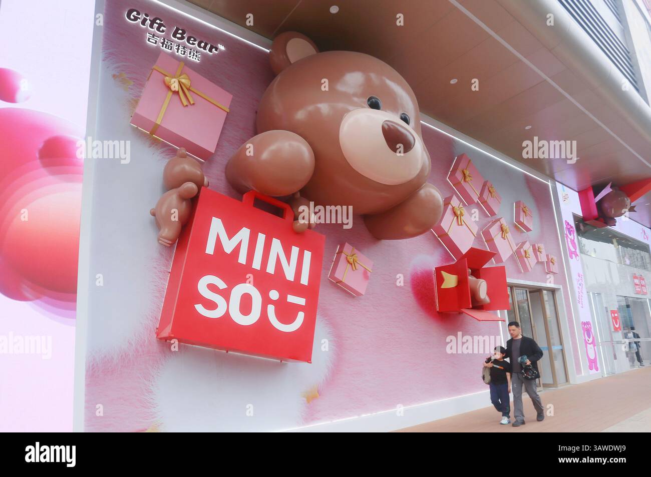 gift bear at the entrance of a newly opened MINISO store, Shanghai ...