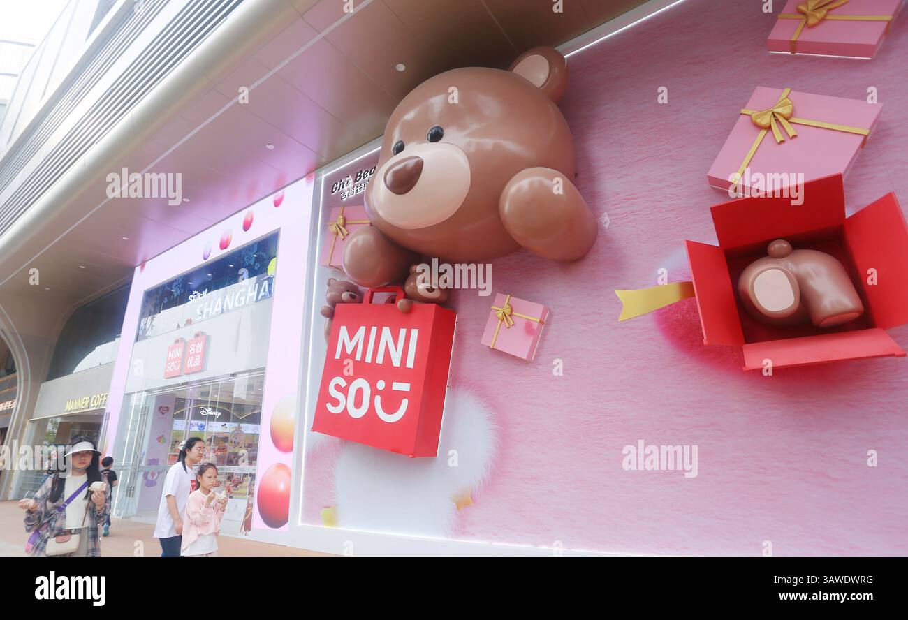 gift bear at the entrance of a newly opened MINISO store, Shanghai ...