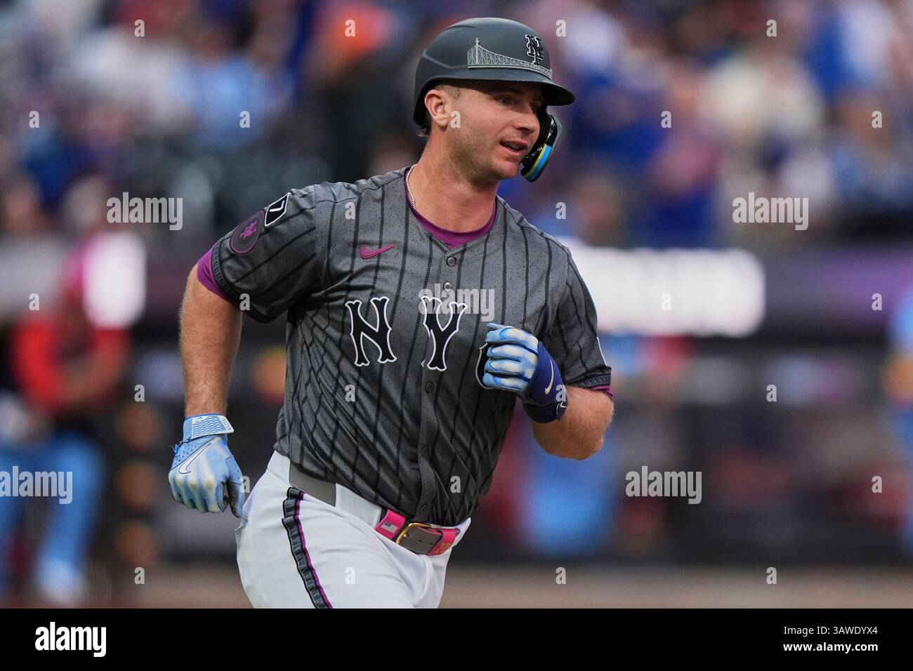 New York Mets' Pete Alonso smiles as he runs the bases after hitting a ...