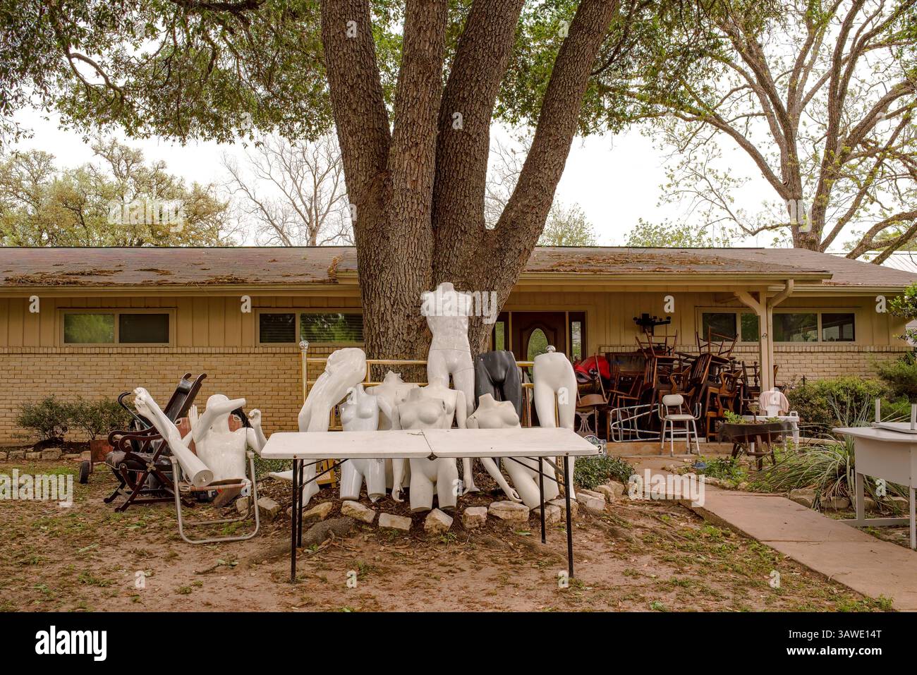 Pile of mannequins and furniture in front of a house from a presumed ...