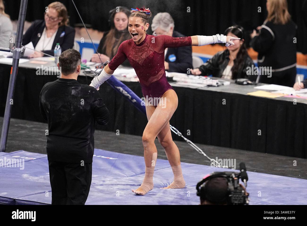 Oklahoma's Jordan Bowers celebrates after competing on the uneven bars ...